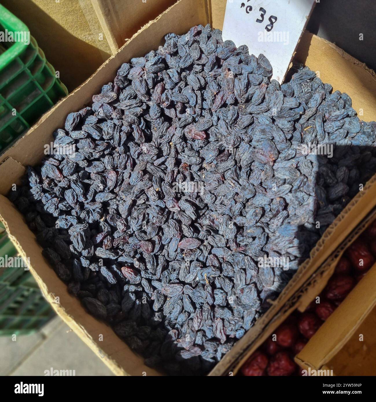 Farmers food market stall with box of Black organic resins Stock Photo ...