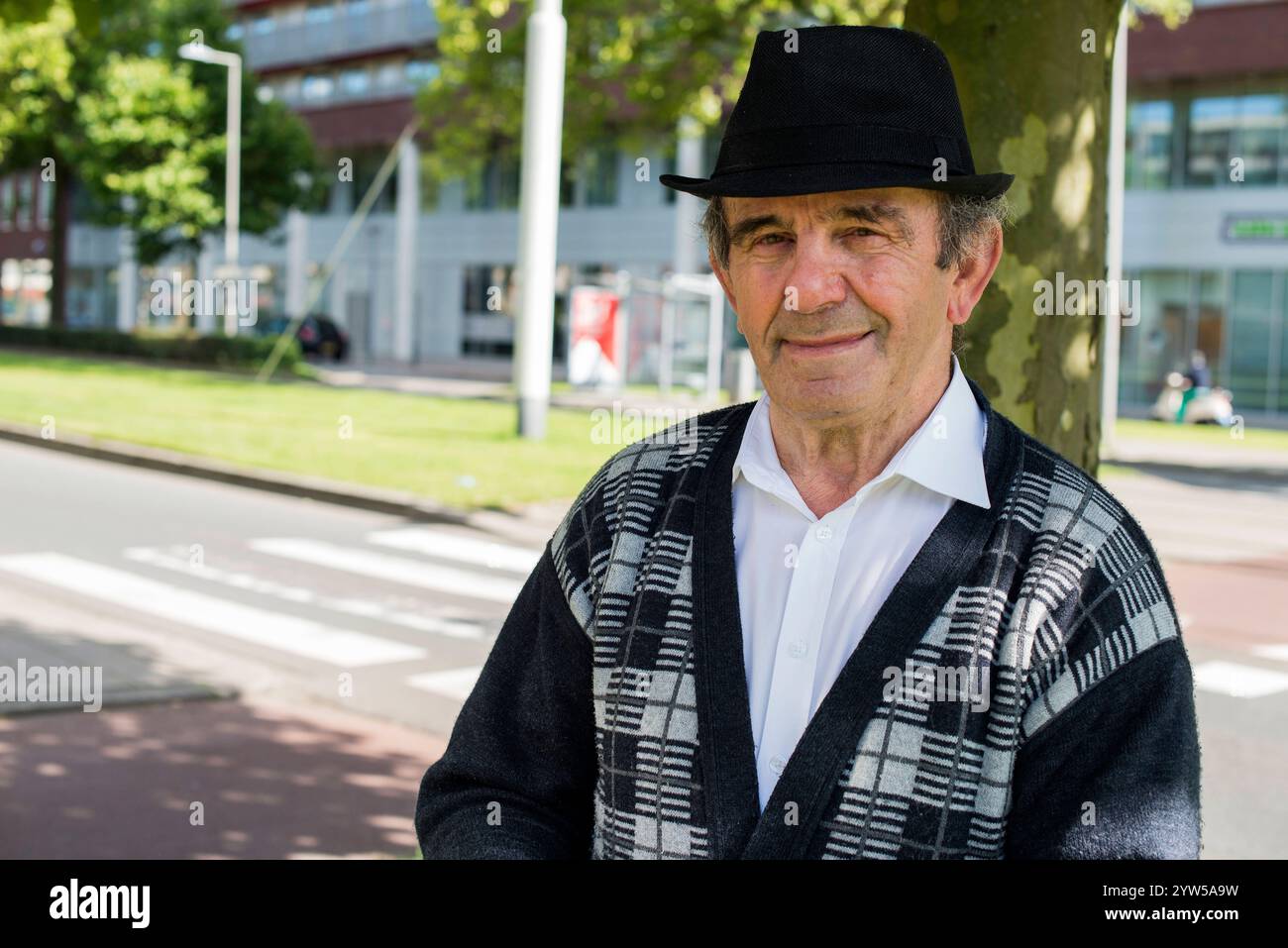 Immigrant man with hat Senior adult male wearing a hat and strolling ...