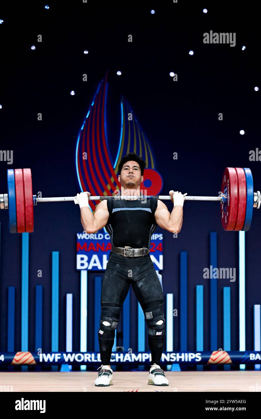 Aznil Bin Bidin Muhamad of Malaysia competes in clean & jerk, in the 67 ...