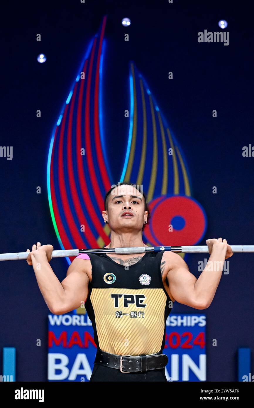 Jyun-Siang Hu of Chinese Taipei competes in snatch, in the 67 kg men ...