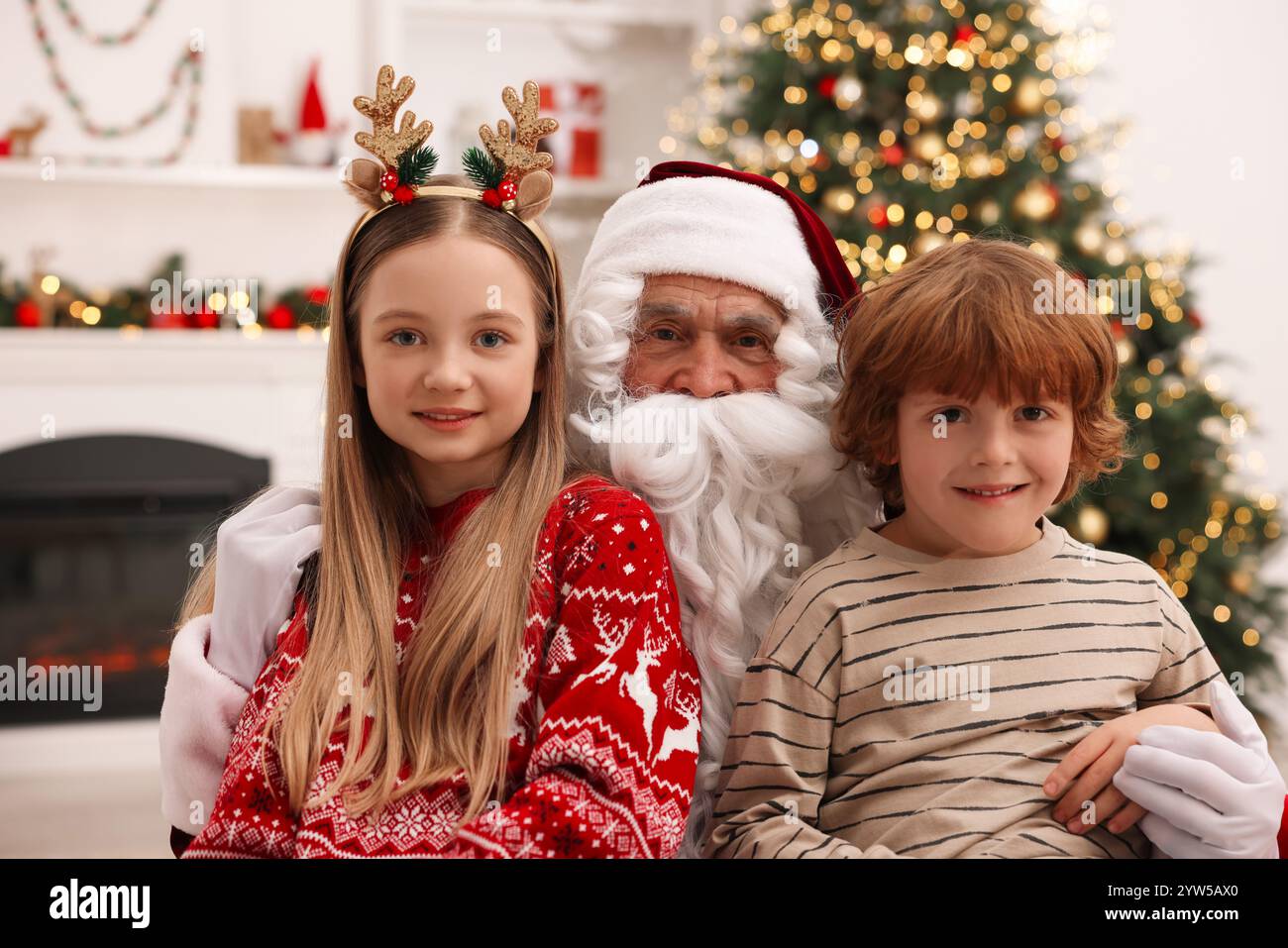Christmas celebration. Santa Claus and children at home Stock Photo - Alamy