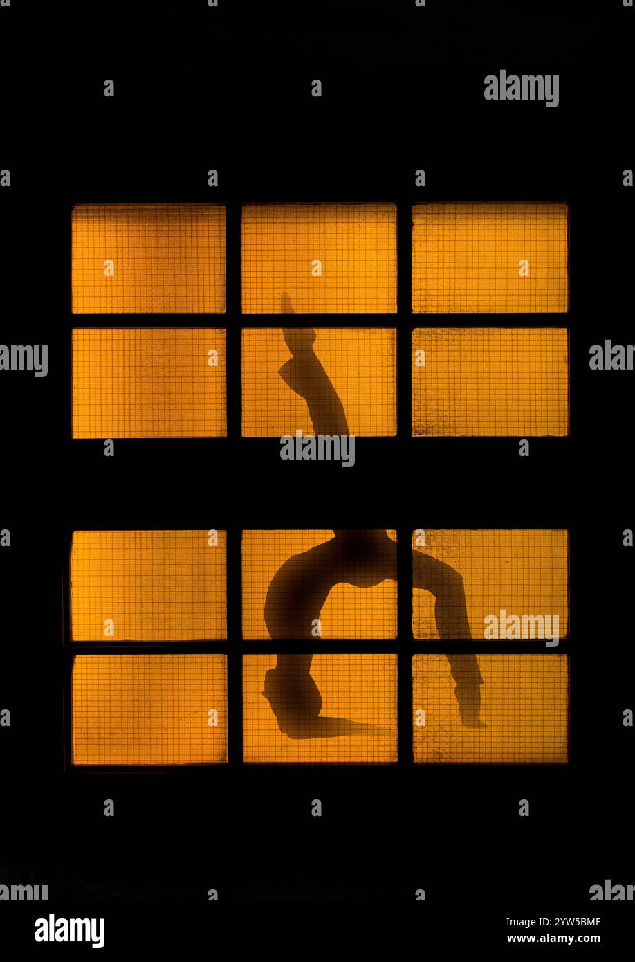 Composite image of view through window of woman in Yoga pose Stock ...