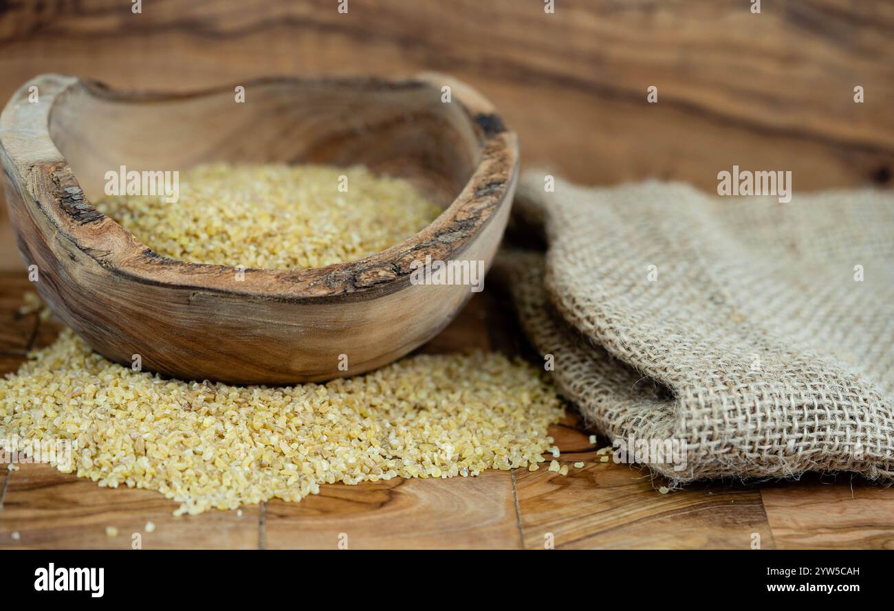 dried bulgur on olive wood Stock Photo - Alamy
