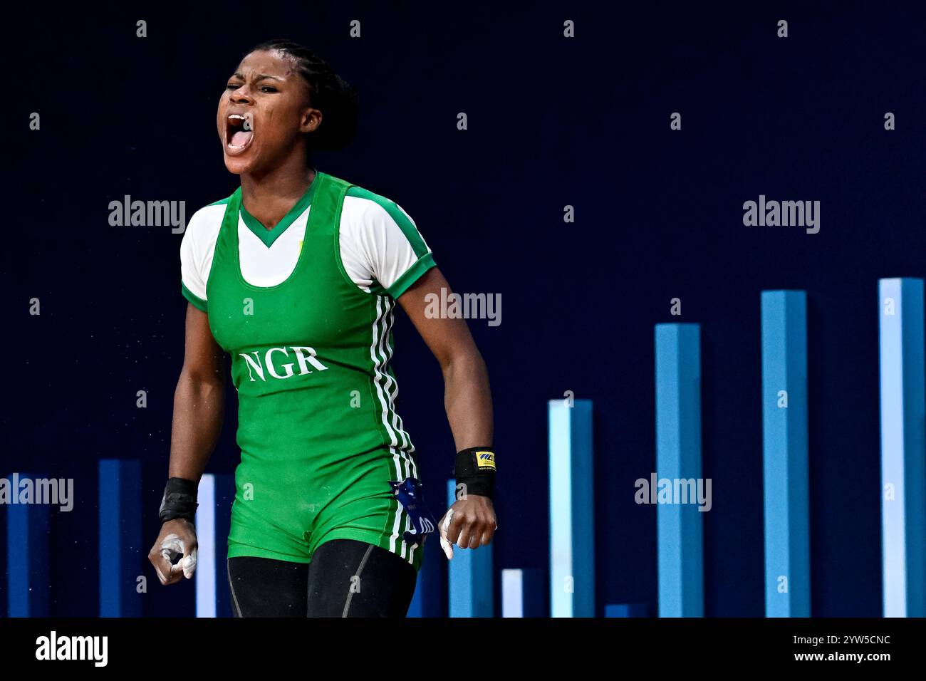 Onome Omolola Didih of Nigeria reacts after competing in snatch, in the ...