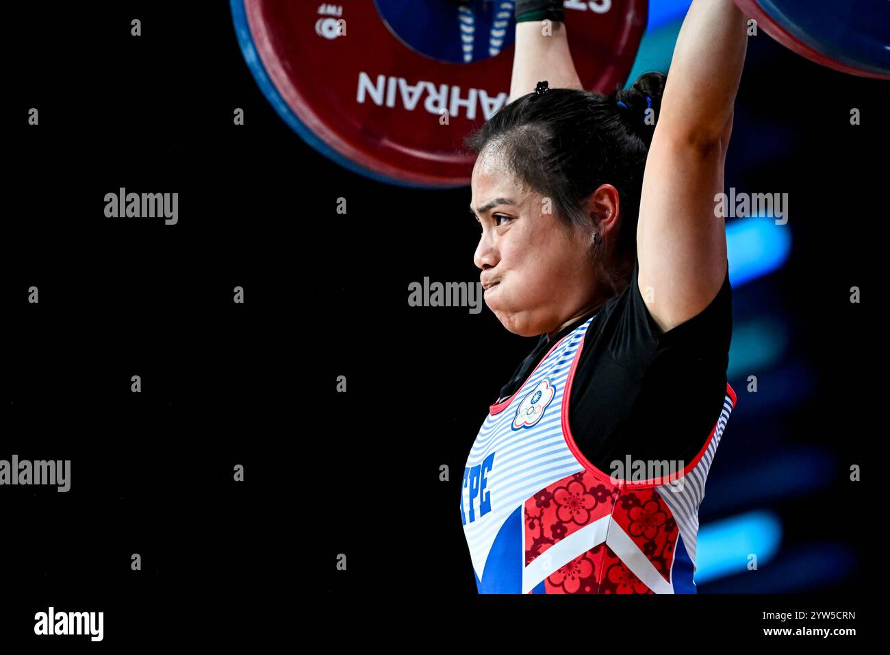Chia-Chi Hu of Chinese Taipei competes in clean & jerk, in the 55 kg ...