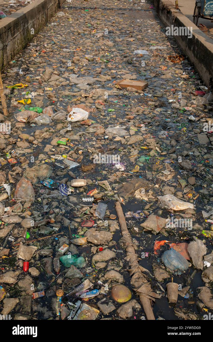 Plastic waste of various types blankets a canal in Dhaka, Bangladesh ...