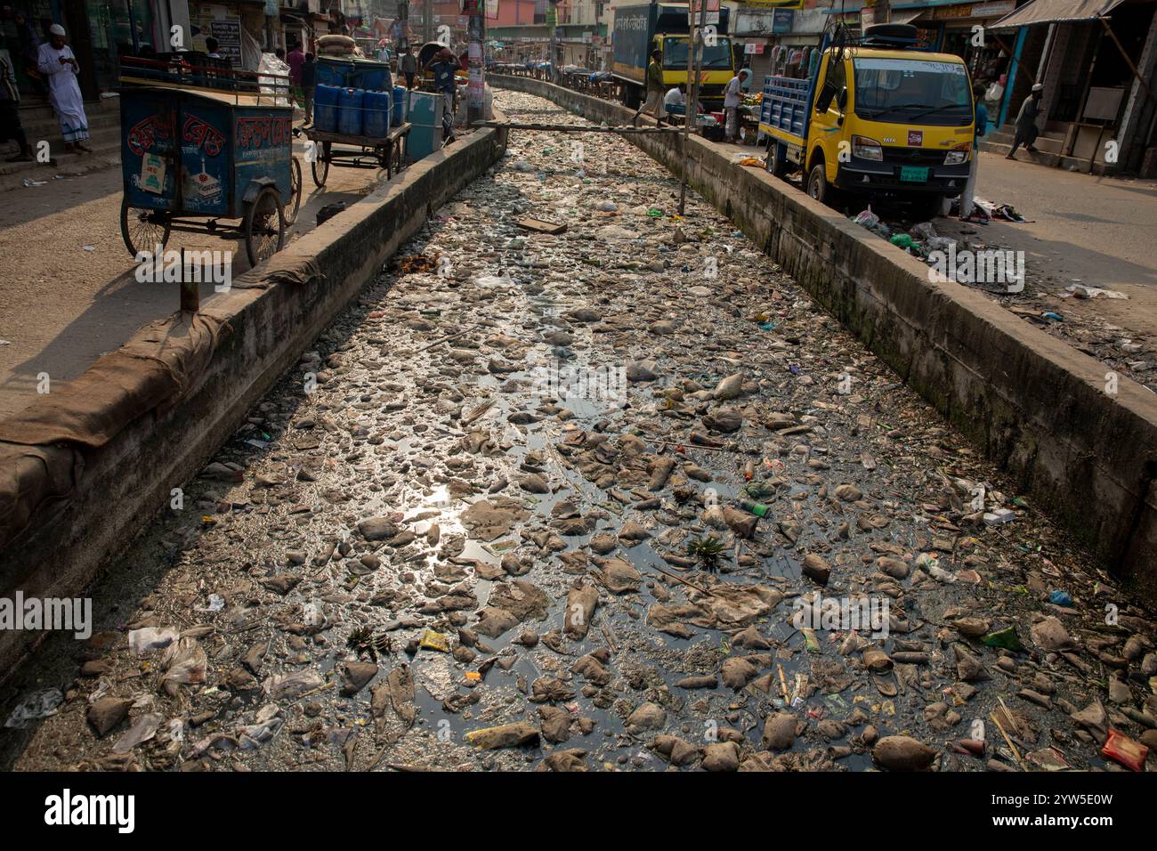 Plastic waste of various types blankets a canal in Dhaka, Bangladesh ...
