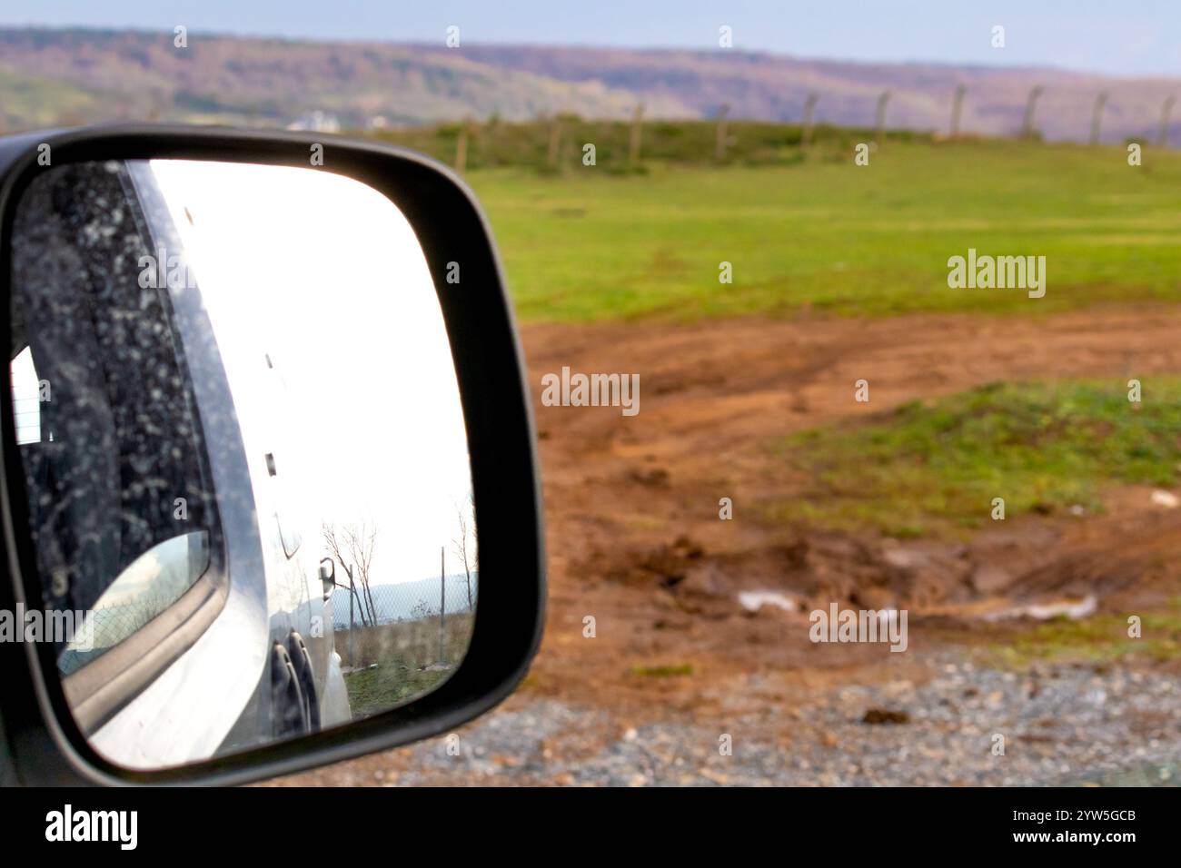 Landscape reflected in car side mirror. Trees and nature in the side ...