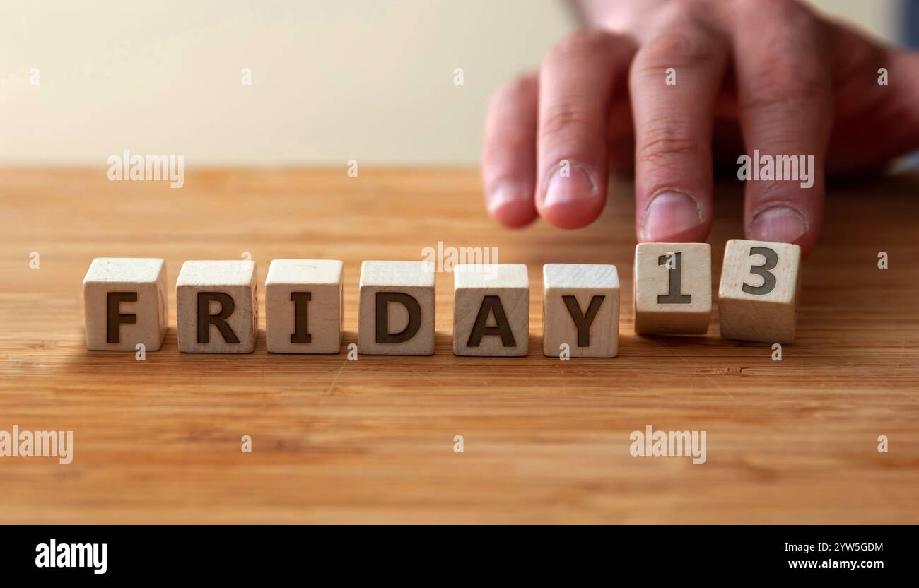 Friday the 13th text on cubes, wooden table background. Bad luck date ...