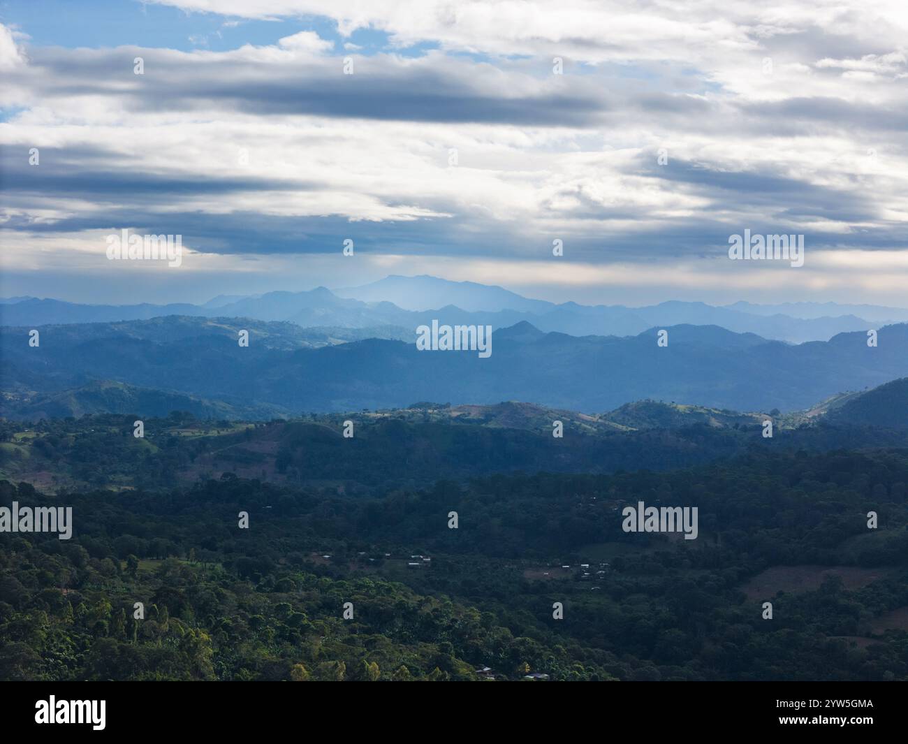 Majestic mountains stretch across horizon, surrounded by lush greenery ...