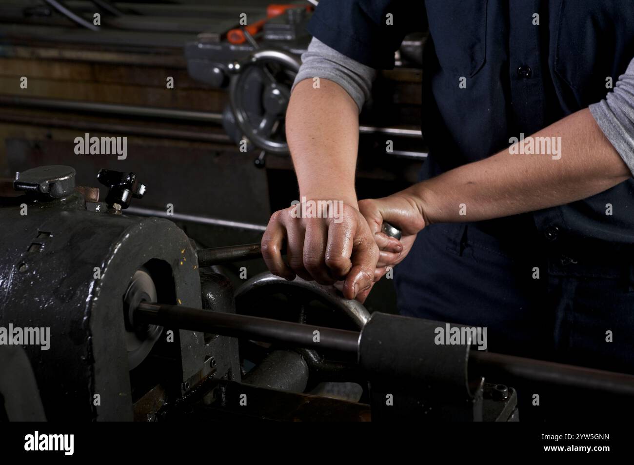 Workers in a local gun factory doing manual labour with their hands ...