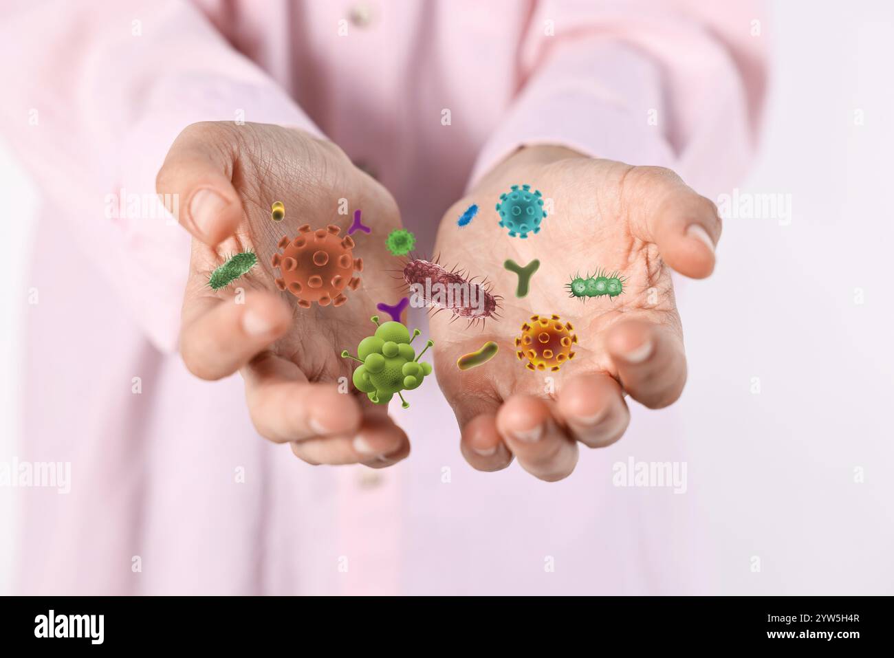 Man showing hands with microbes on white background, closeup ...