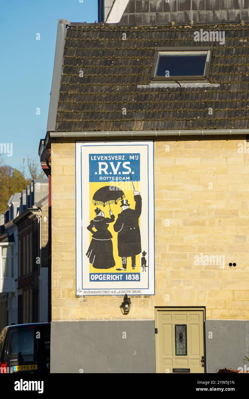 Vintage publicity mural restored , RVS insurance on a wall in ...