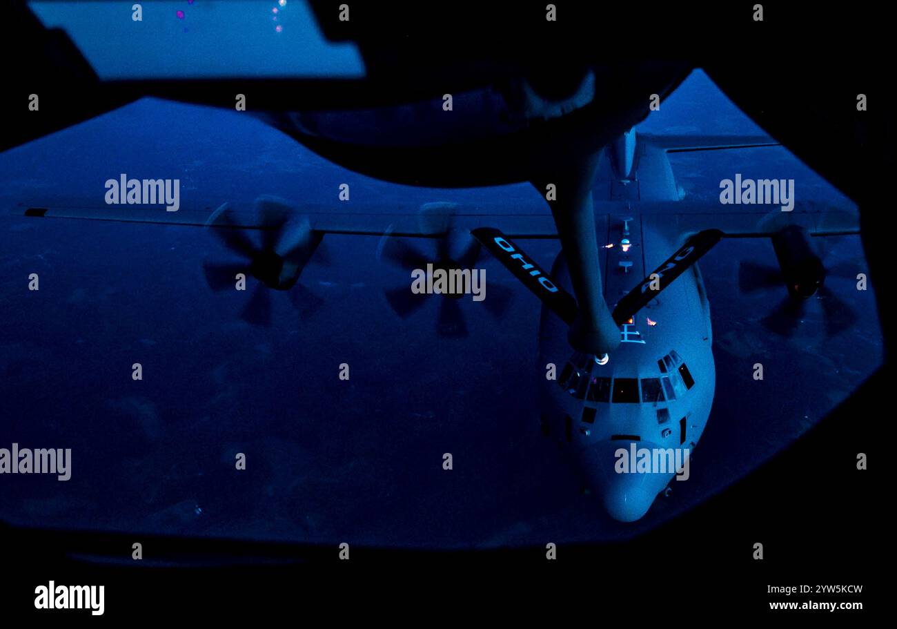 A KC-135 Stratotanker with the 121st Air Refueling Wing refuels a C-130 ...