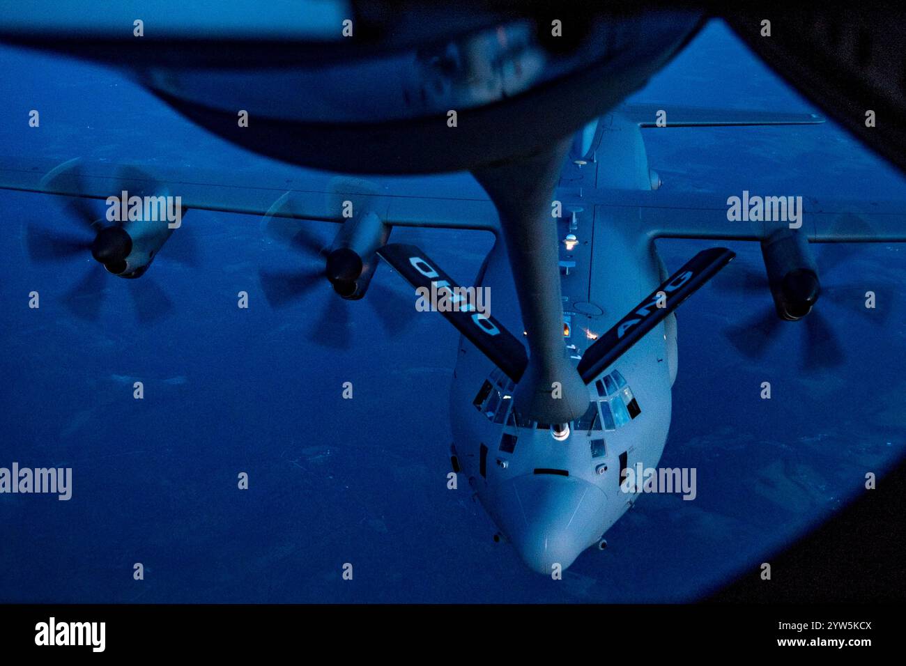 A KC-135 Stratotanker with the 121st Air Refueling Wing refuels a C-130 ...