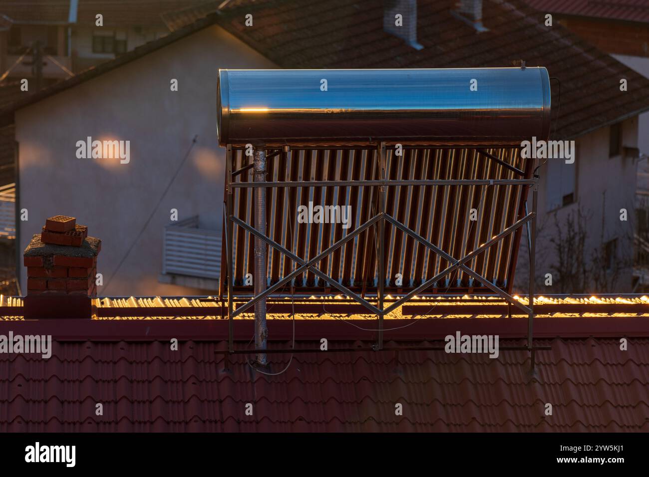 Harnessing the Sun: Solar Panel Absorbing the Last Rays. Red brick ...