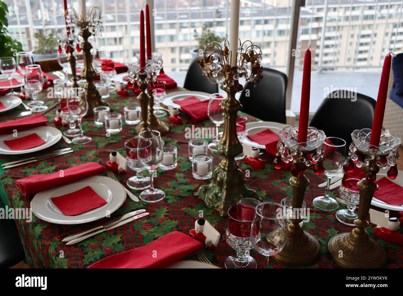 Christmas dinner table settings infront of large windows with view, in ...