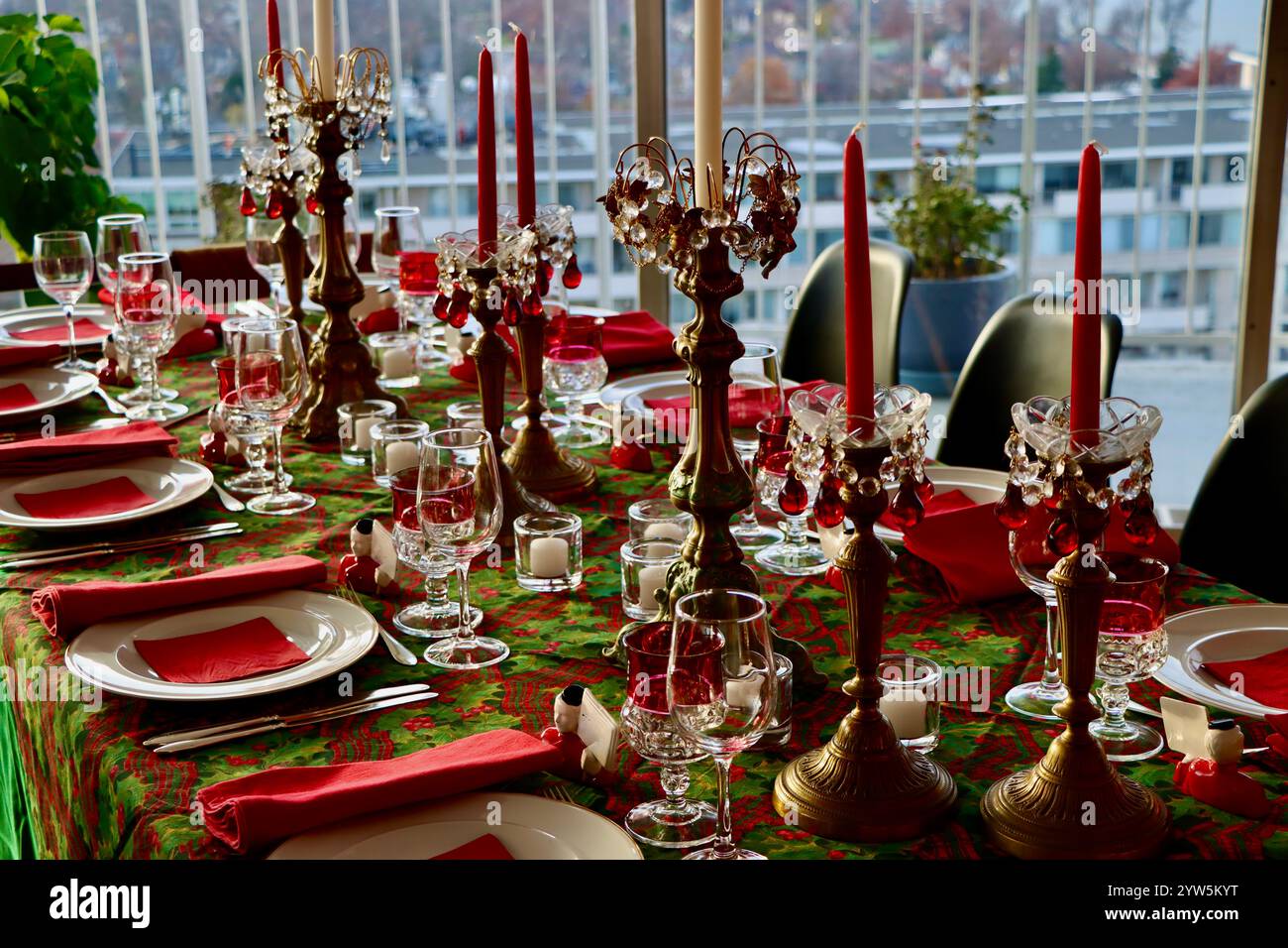 Christmas dinner table settings infront of large windows with view, in ...