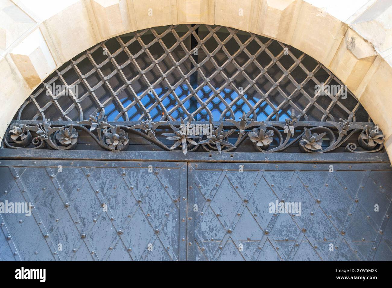 Ornate wrought iron gate with floral details, diamond patterns ...