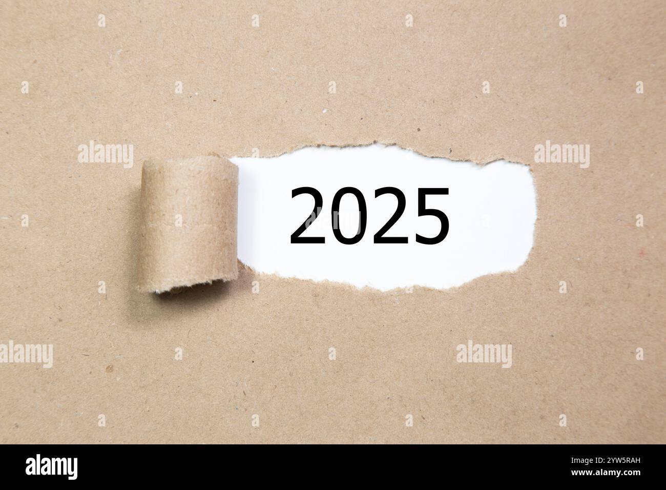 2025 on Torn Paper. New year concept with typographic 2025 on paper ...