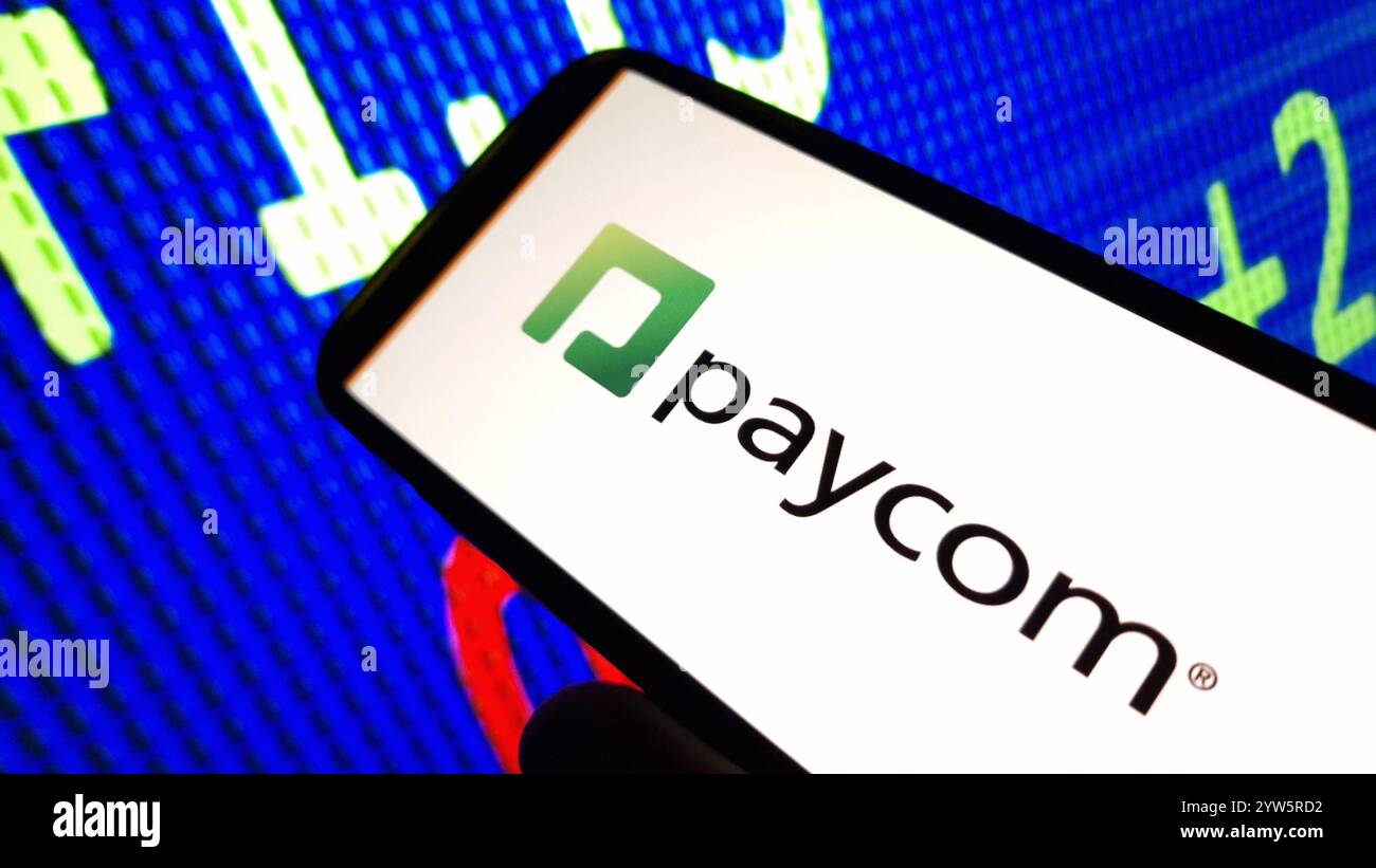 Konskie, Poland - December 08, 2024: Paycom company logo displayed on ...