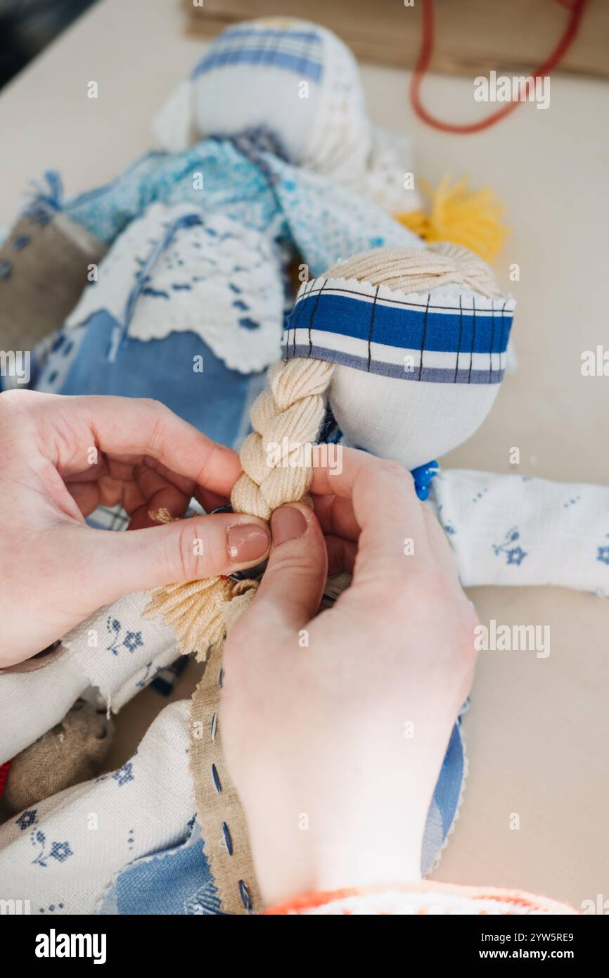 Handmaking traditional folk dolls with intricate details. Celebrating ...