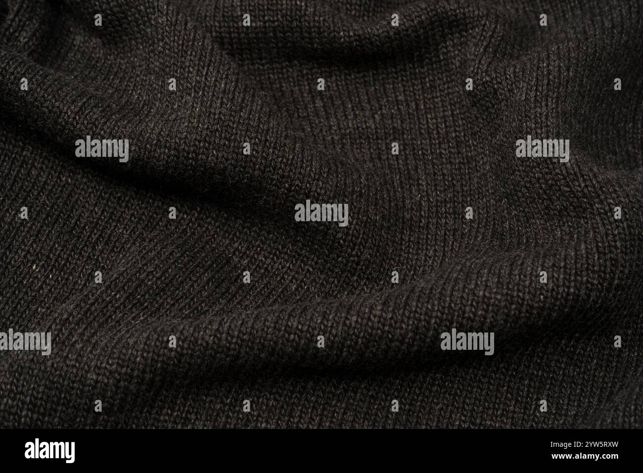 Dark grey sweater texture as a background. Knitted pattern. Top view ...