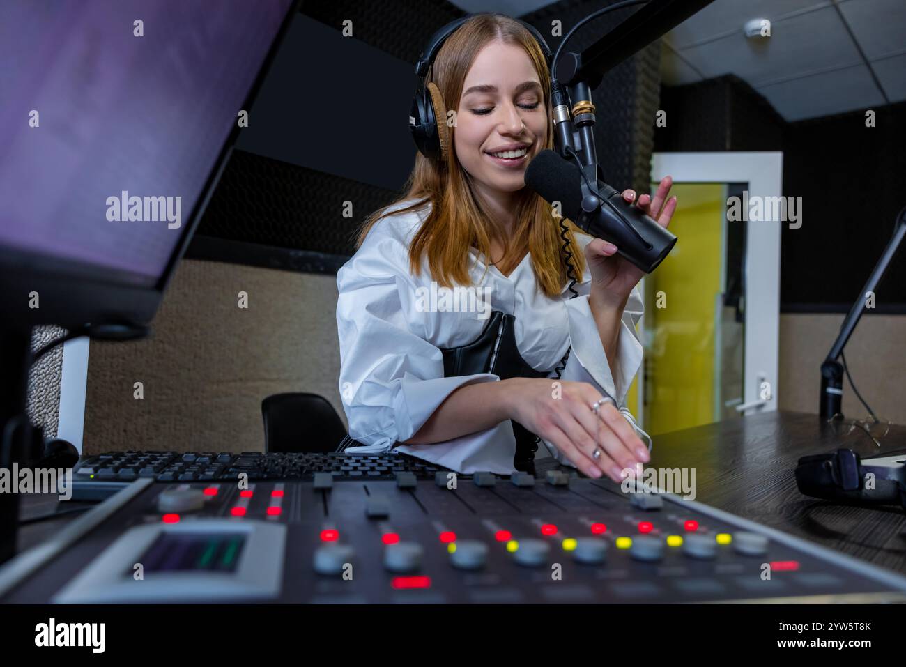 Woman radio host mixing audio at radio station live show Stock Photo ...