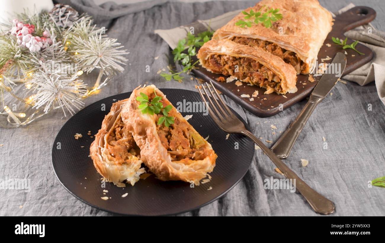 Puff pastry vegetable roll on kitchen decorated countertop Stock Photo ...