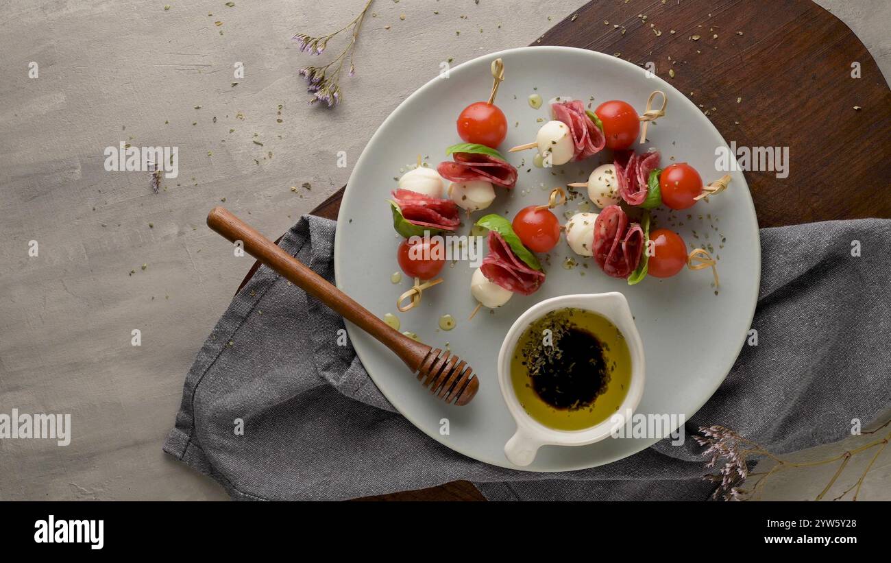 Italian style appetizer, antipasto skewer or caprese on a stick with ...