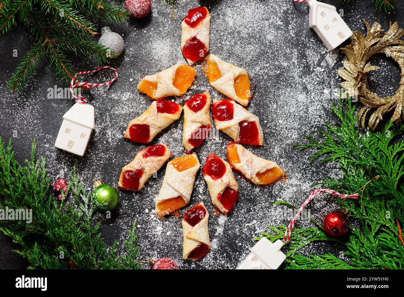 Raspberry filled bow tie cookies kolaczki on a Christmas rustic ...