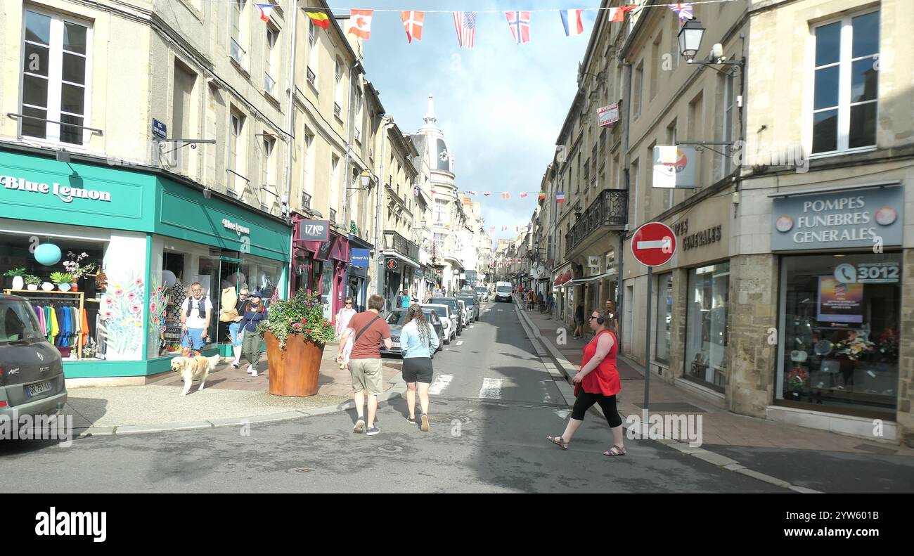 Bayeux France French street people walking flags flag British English ...