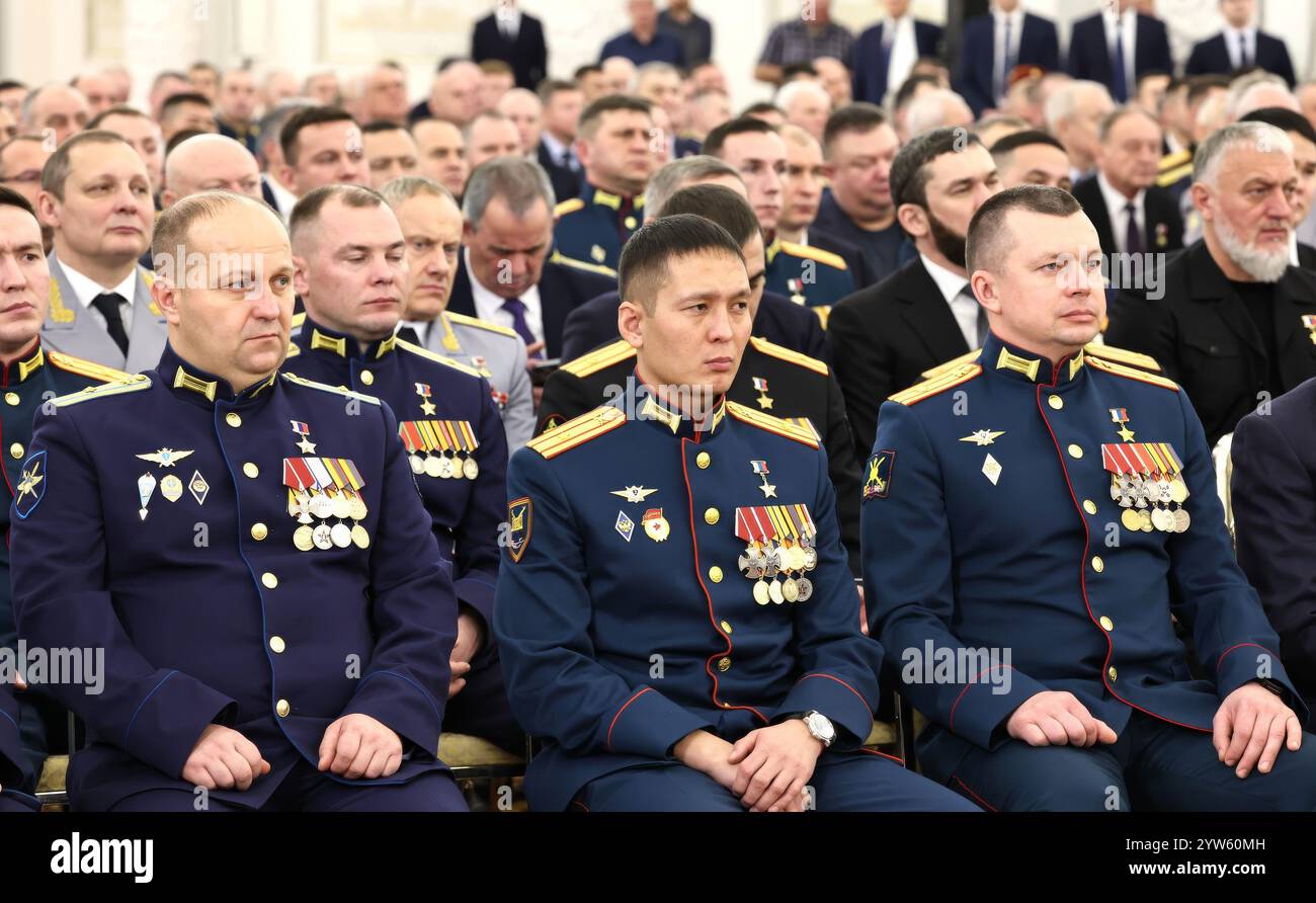 Moscow, Russia. 09th Dec, 2024. Members of the audience look on as ...