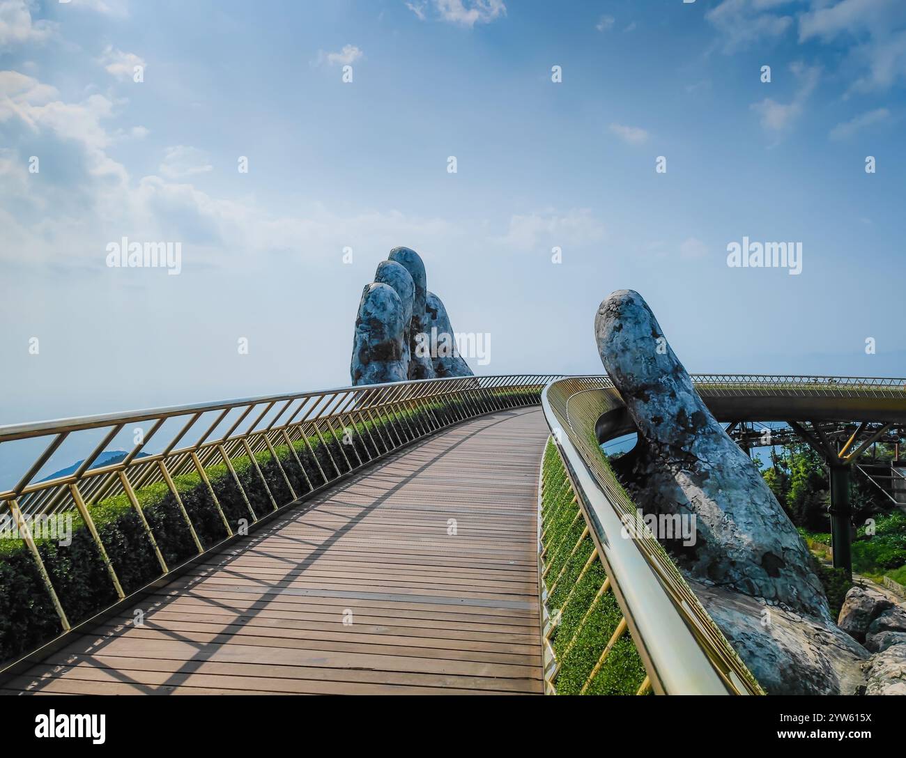 Golden Bridge in Ba Na hills, Da Nang, Vietnam on a sunny day. Lifted ...