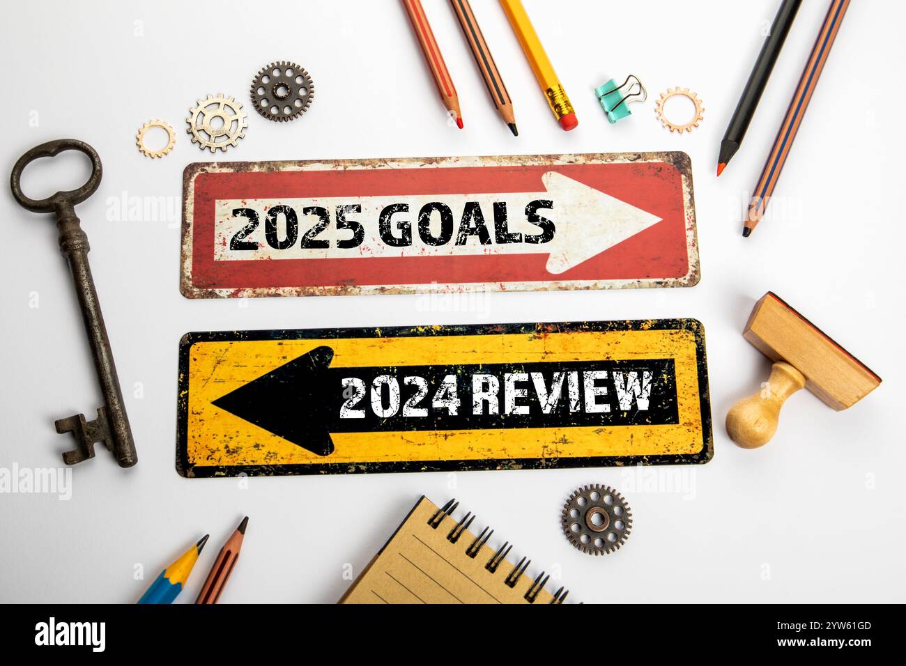 2025 Goals and 2024 Review. Two directional arrows on a white office ...