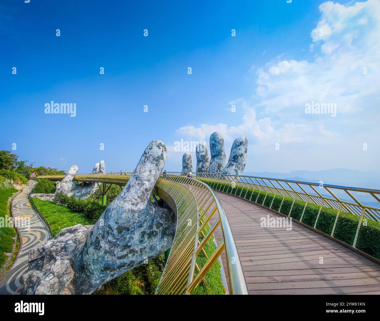 Golden Bridge in Ba Na hills, Da Nang, Vietnam on a sunny day. Lifted ...