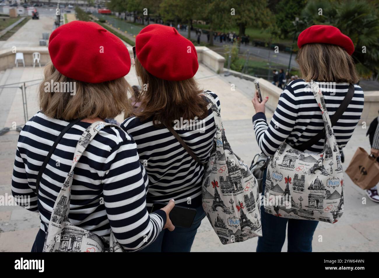 Women in red beret’s at the Eiffel Tower, in Paris, France, on 27 ...
