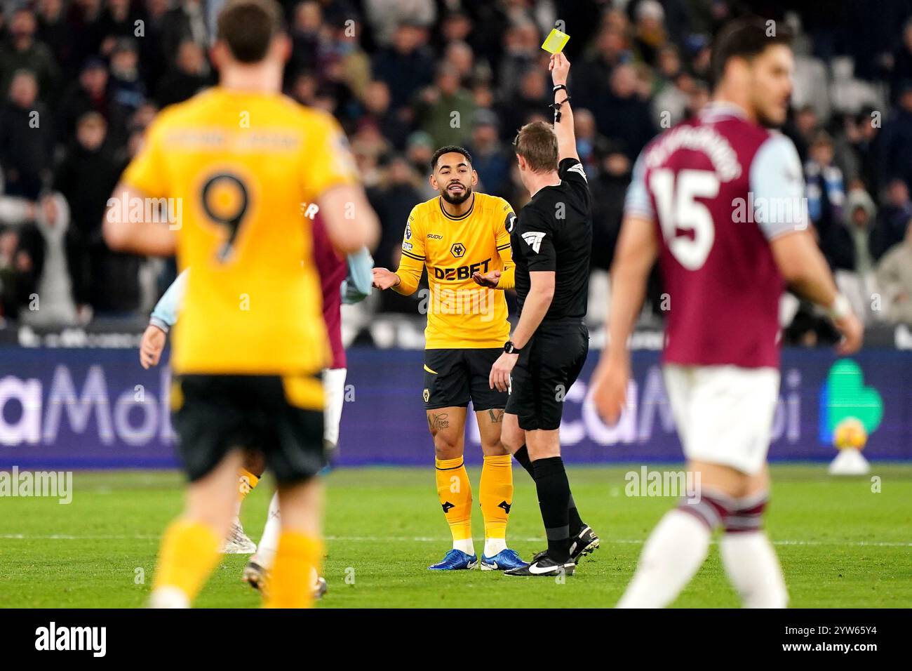 Wolverhampton Wanderers' Matheus Cunha is shown a yellow card by ...