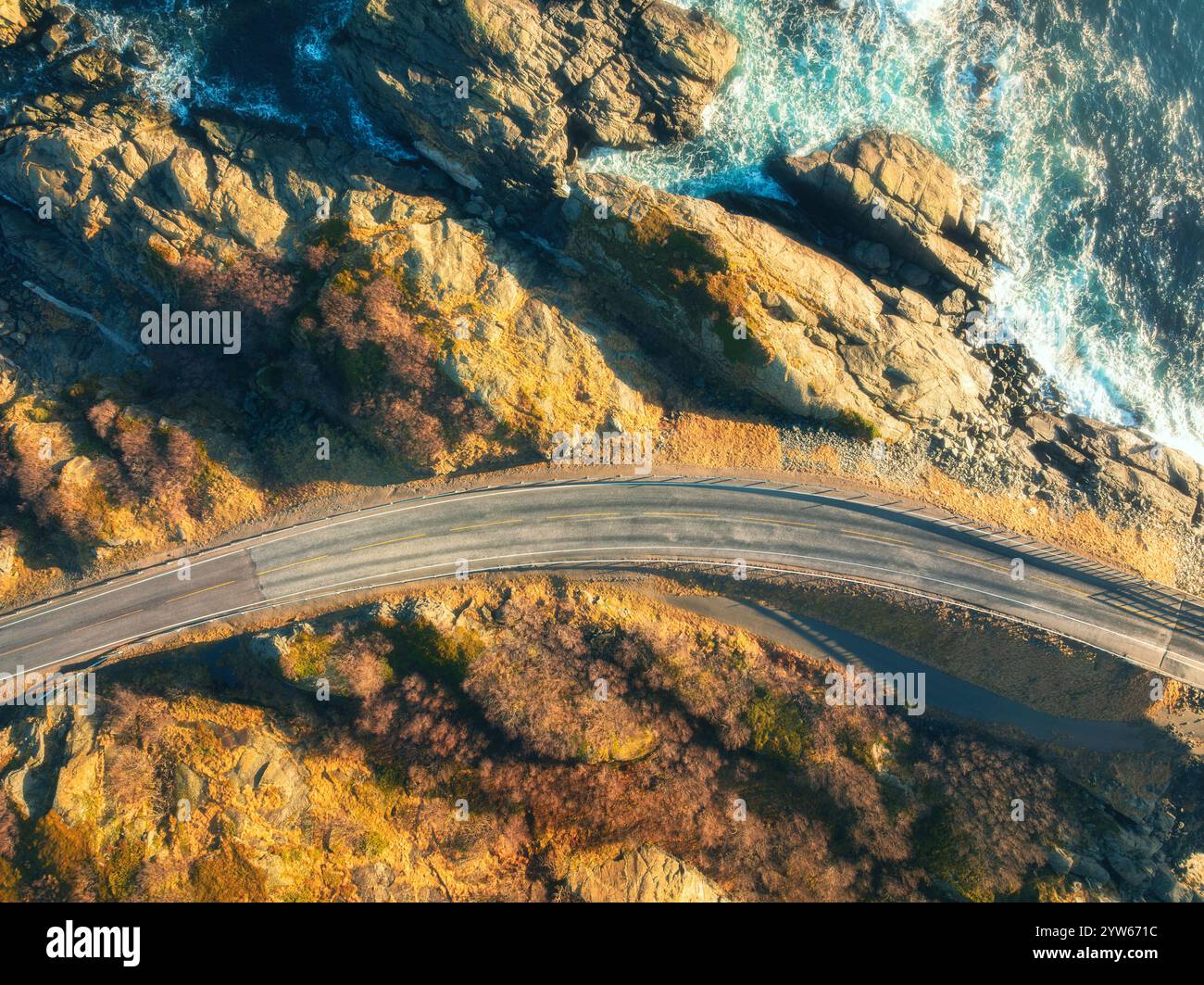 Aerial view of winding coastal road, cliffs and sea with waves Stock ...