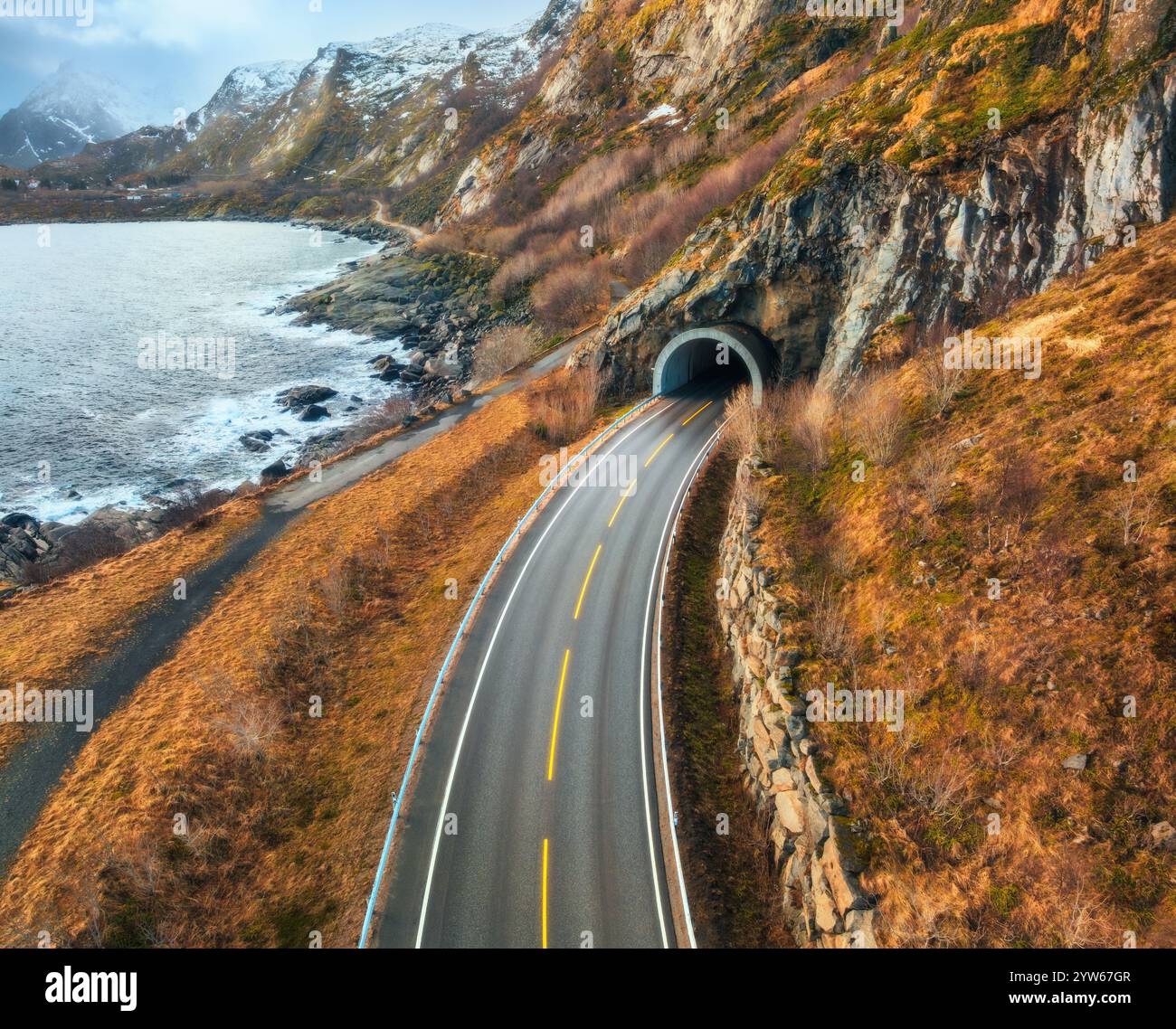 Aerial view of winding asphalt road leading to a tunnel entrance Stock ...
