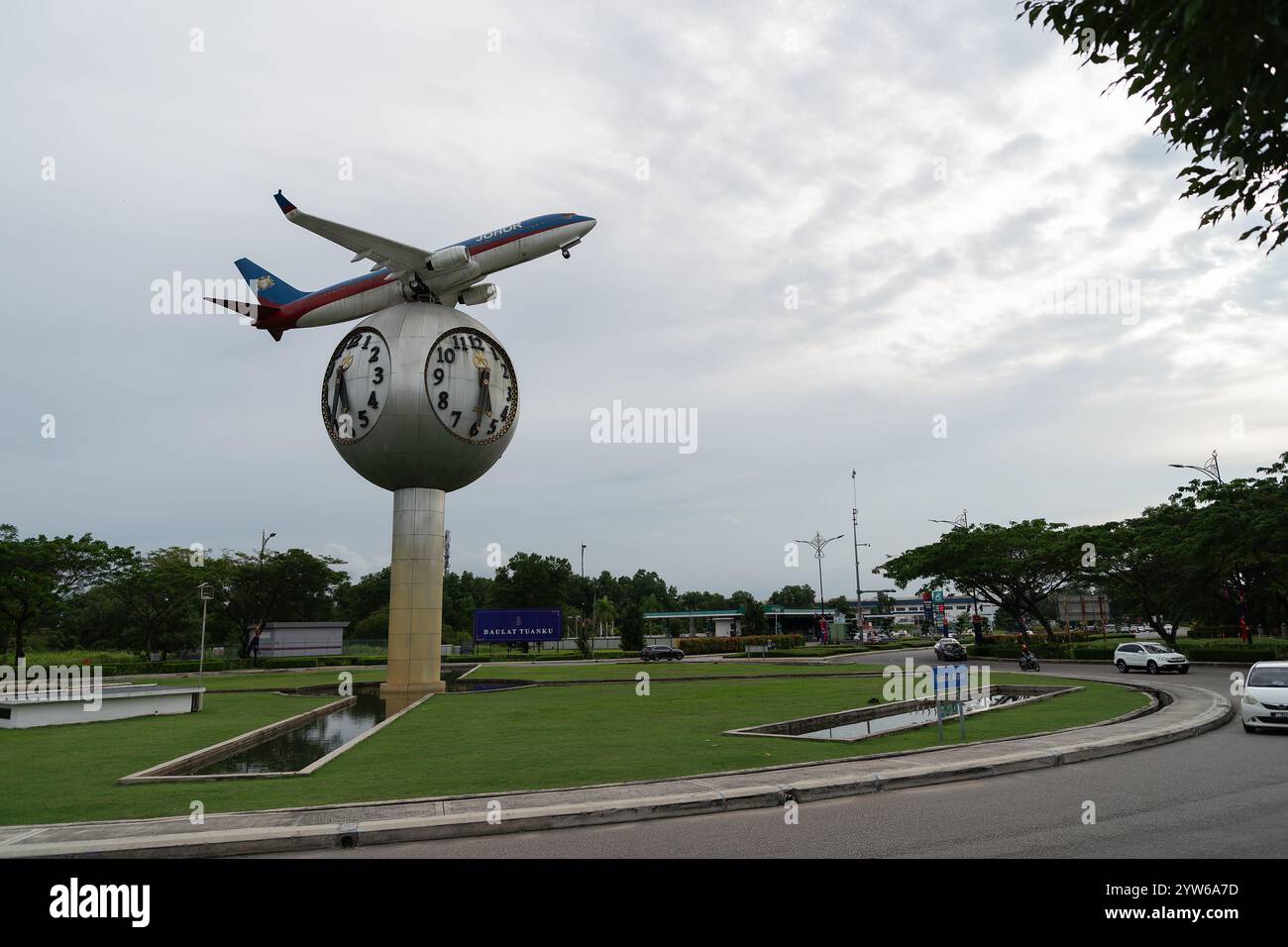 SENAI, MALAYSIA - NOVEMBER 27, 2023: street-level view of a clock tower ...
