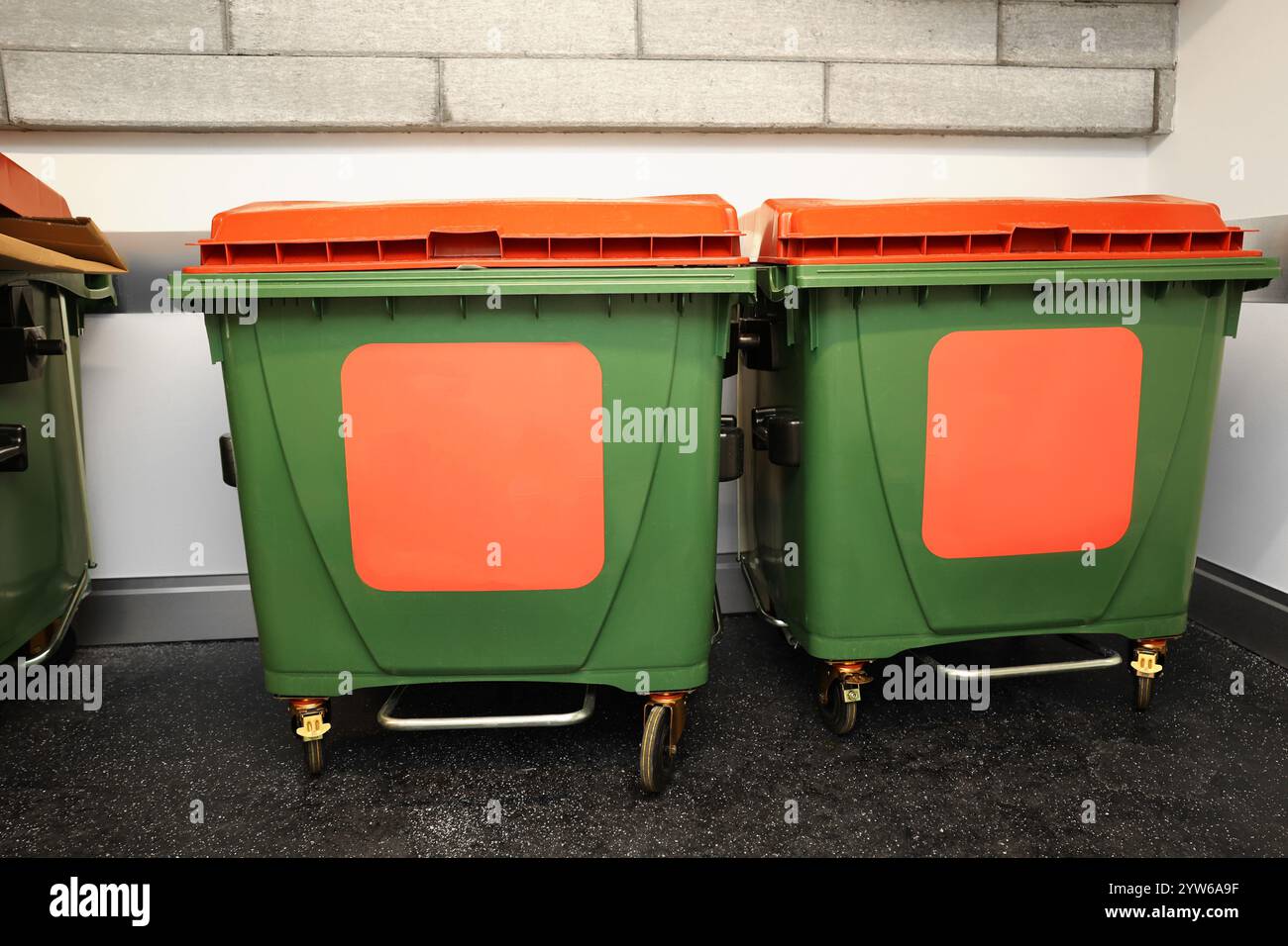 Paper recycling containers in room Stock Photo - Alamy