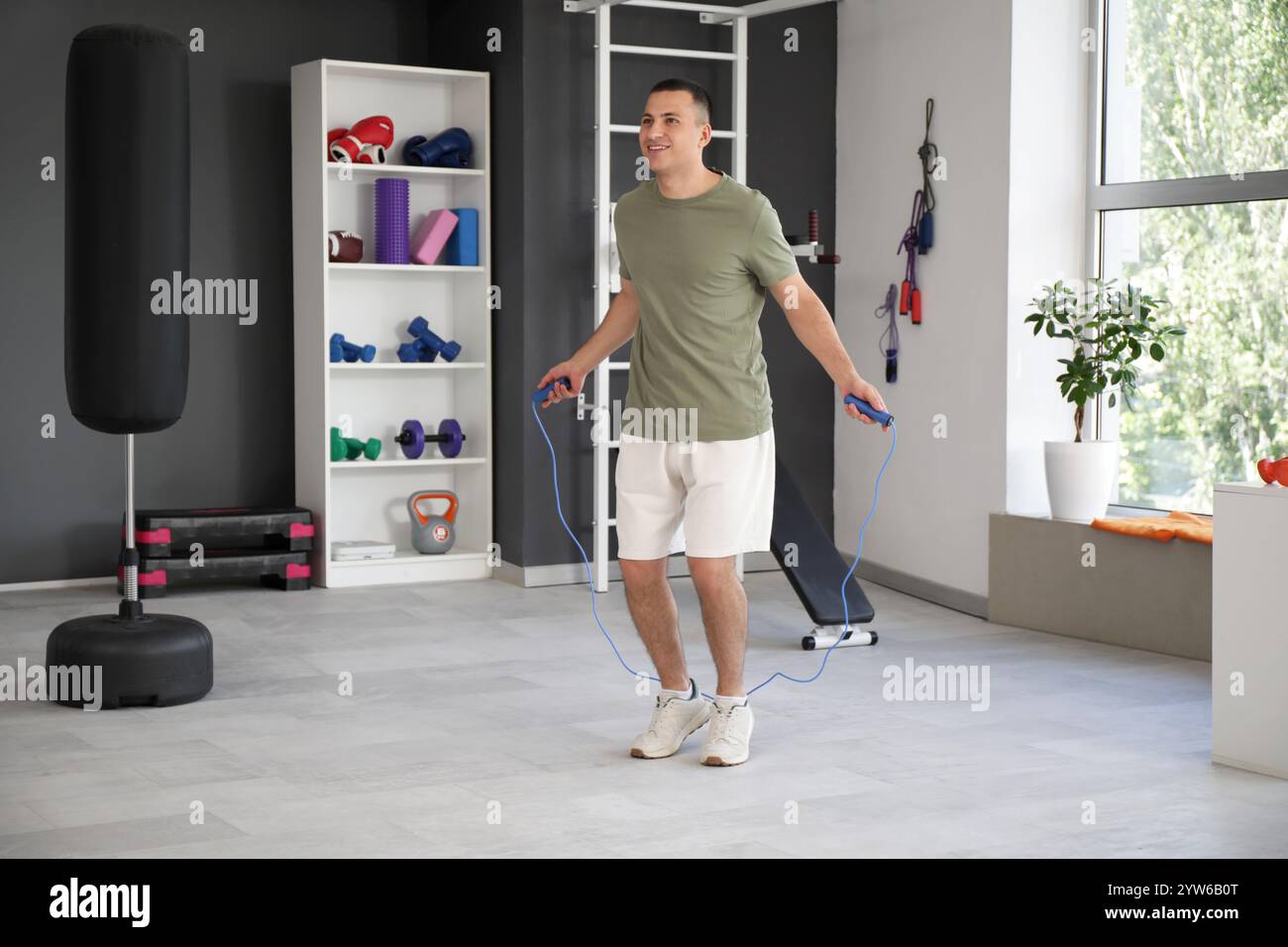Man jumping rope in gym hi-res stock photography and images - Alamy