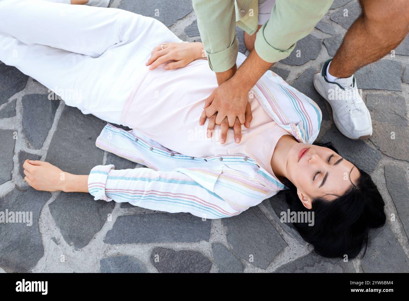 Unconscious woman on ground hi-res stock photography and images - Alamy