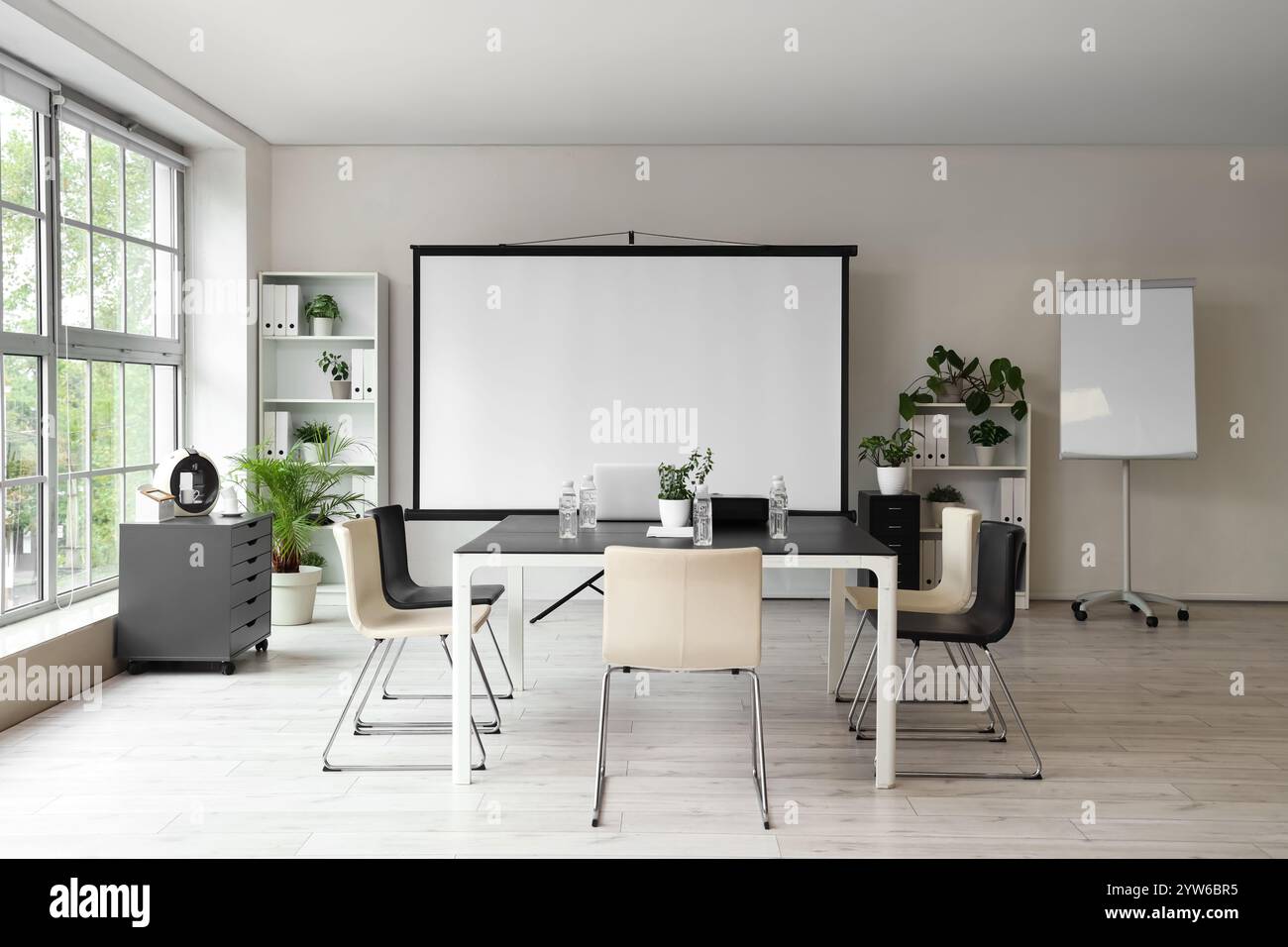 Interior of office with projector screen and meeting table Stock Photo ...
