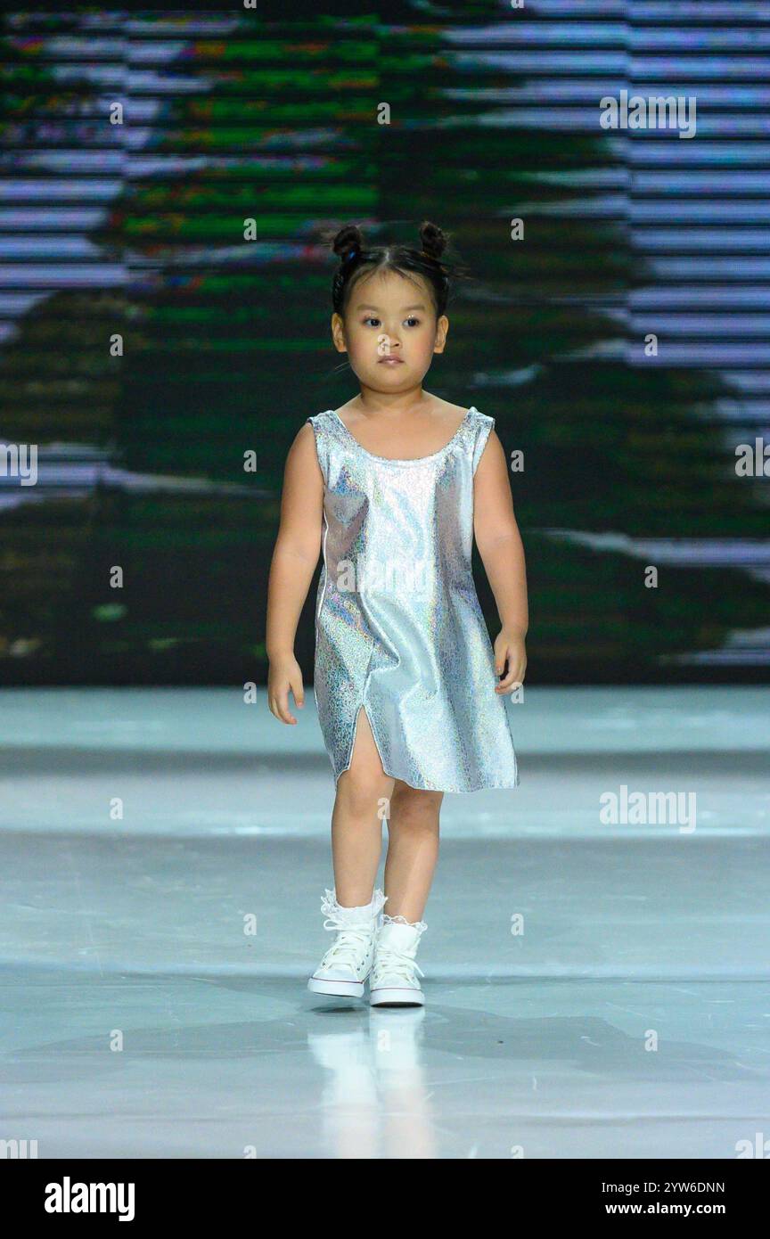 Toronto, ON, Canada - December 7, 2024: A model walks the runway at the ...