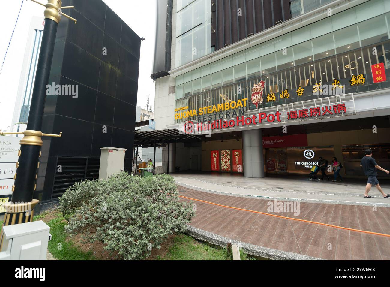 JOHOR BAHRU, MALAYSIA - NOVEMBER 23, 2023: street-level view of ...