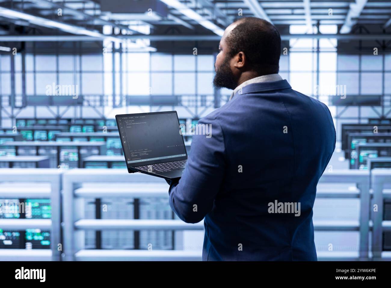 IT staff member in data center implementing backup solutions to protect against infrastructure ...