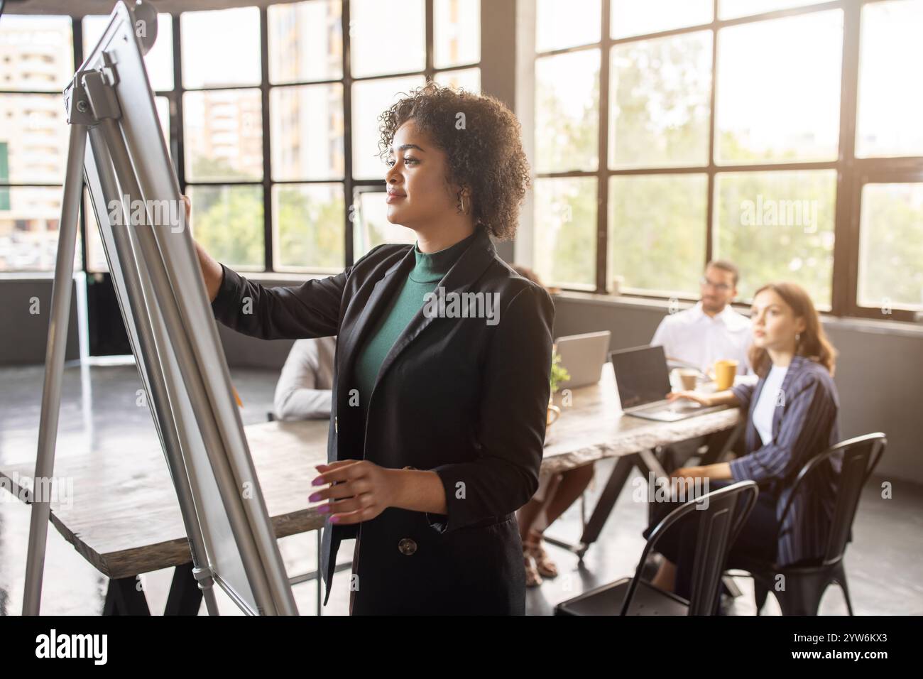 Team collaborates in office setting hi-res stock photography and images ...