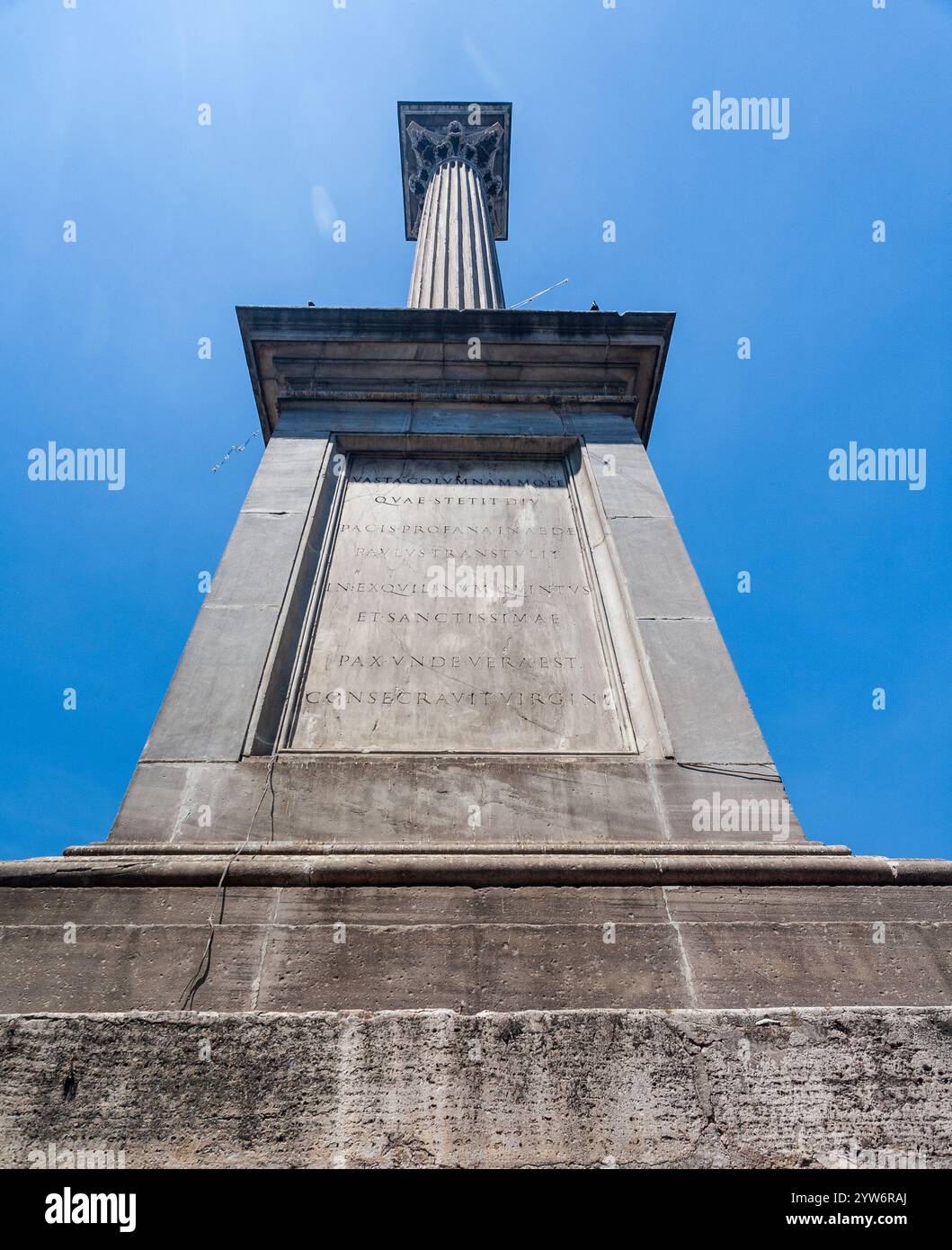 The grand column stands tall against a clear blue sky in Piazza di ...